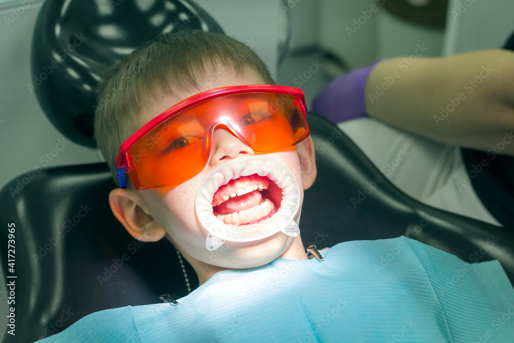 Kids dentistry. Children's dentist examination baby teeth. Emotions of ...