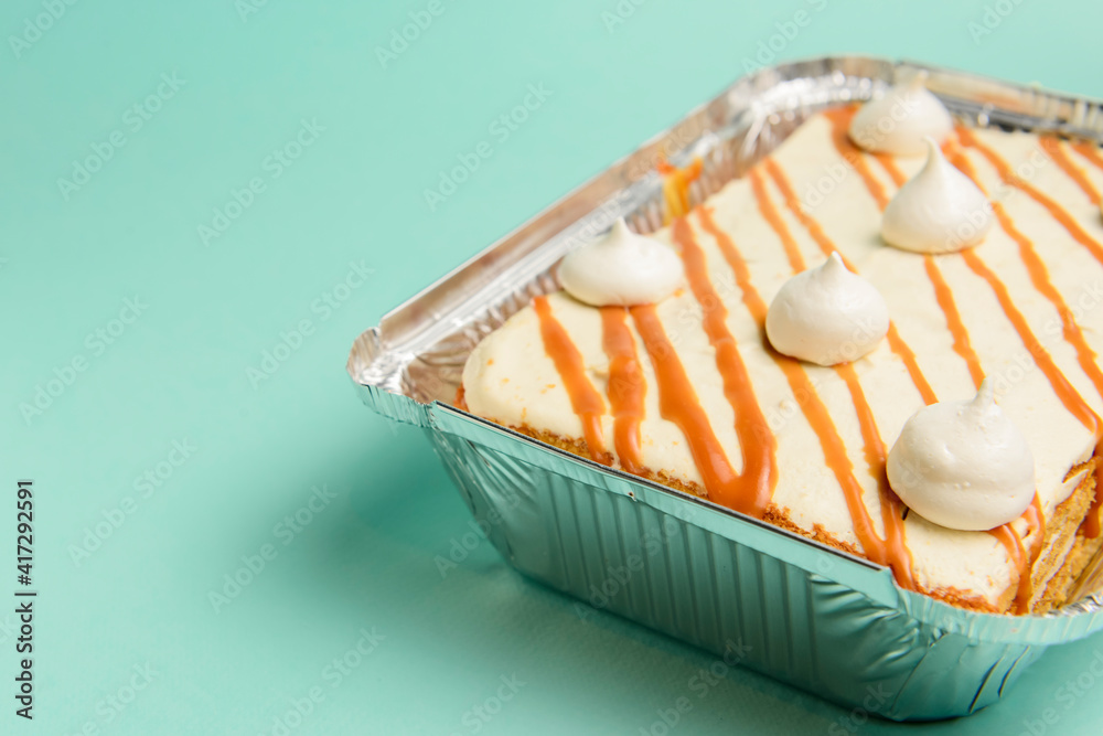 Healthy dessert. Sweet vanilla cake closeup in foil delivery box. Food ...