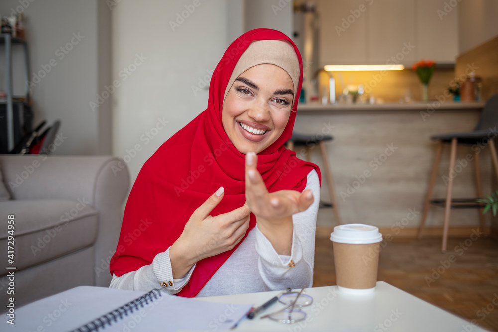Islamic woman chatting. Businesswoman in hijab having a video chat on ...