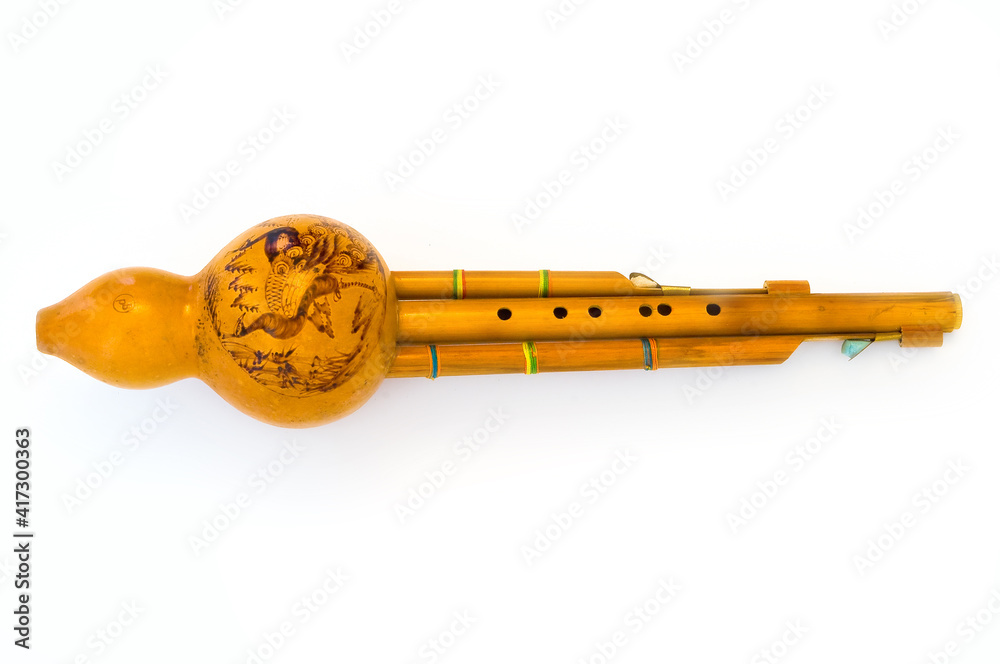 A replica of a musical instrument called a bansuri. The instrument ...