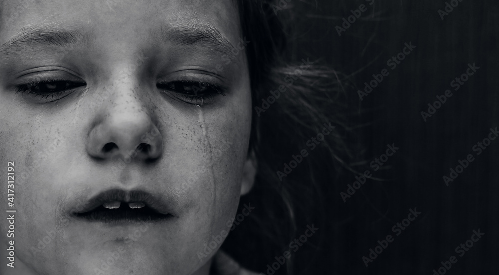 Dramatic photo of a crying kid Stock Photo | Adobe Stock