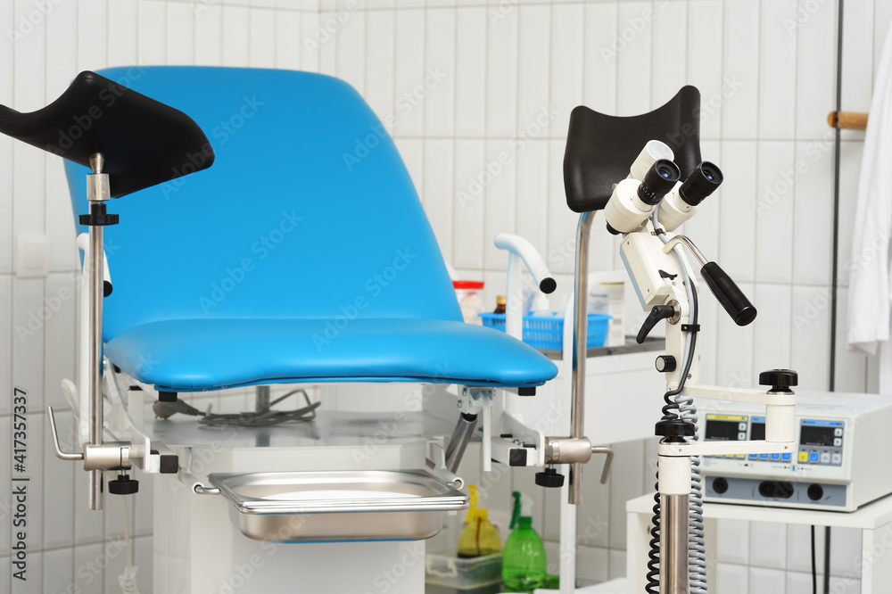 blue gynecological chair and colposcope close-up in a modern clinic ...