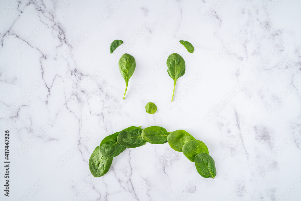 Funny Fresh Organic Sad Face Emoji Spinach Isolated in Overhead Shot on ...