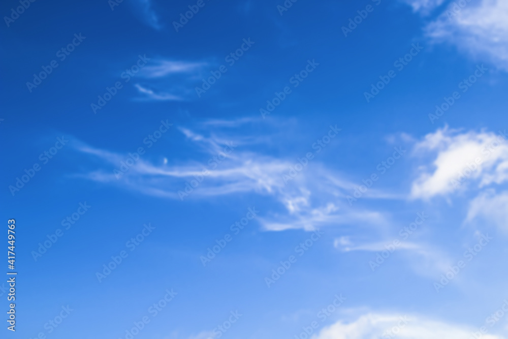 Defocused slice of the July sky. On a warm summer day, soft clouds and ...