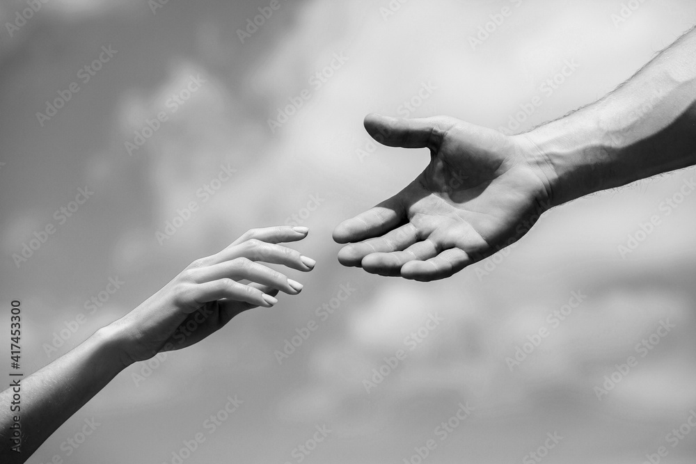 Solidarity, compassion, and charity, rescue. Hands of man and woman ...