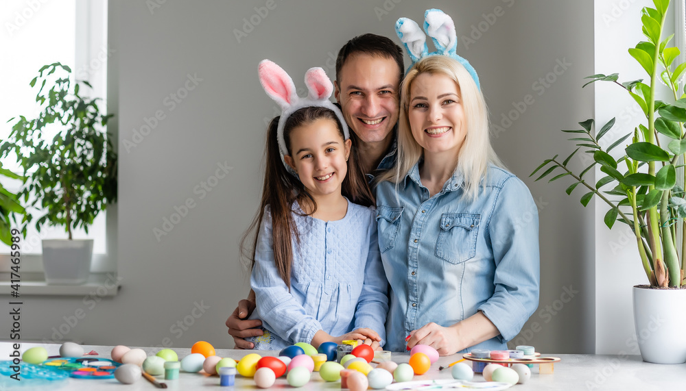 happy family with easter eggs. Happy family preparing for Easter Stock ...
