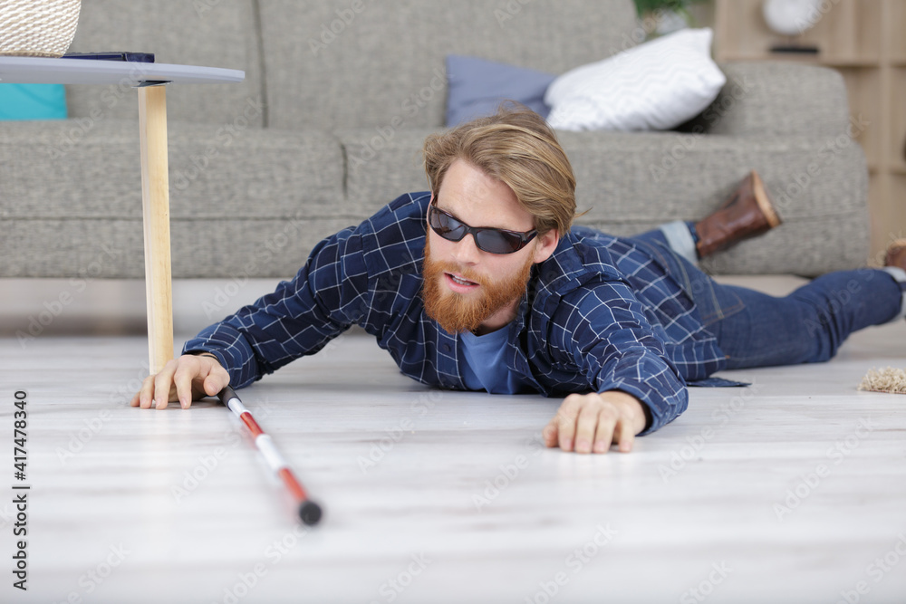 blind man fallen on the floor in his home Stock Photo | Adobe Stock