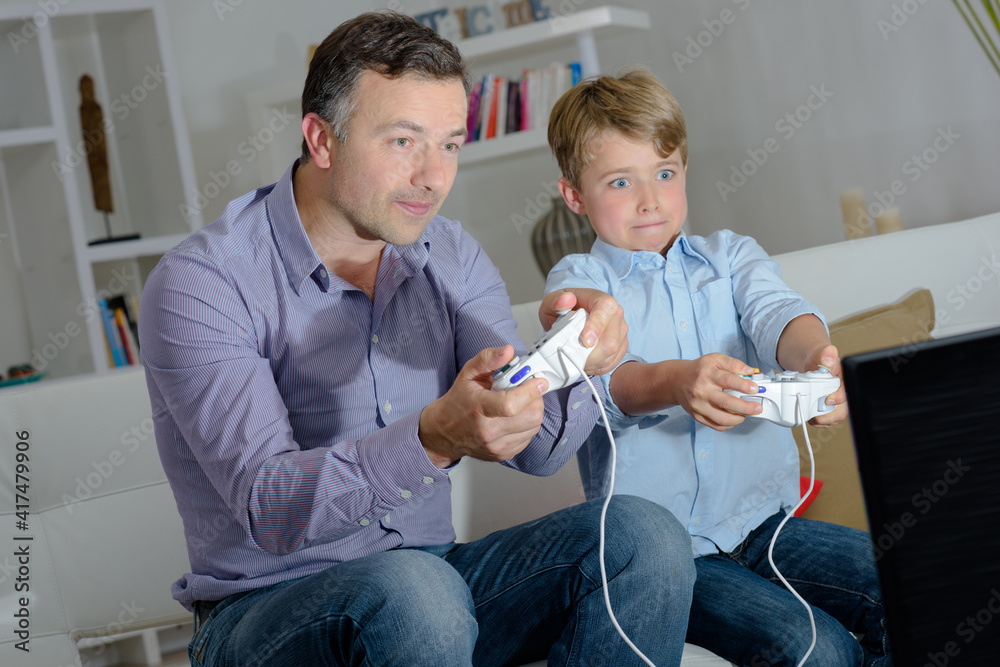 dad with his son playing video games Stock Photo | Adobe Stock