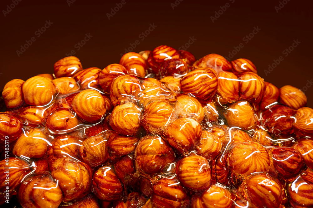 Delicious sweet hazelnut nuts in sugar caramel. Preparation of desserts ...