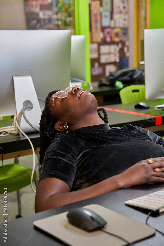 Black female college student tired and exhausted in computer lab Stock ...