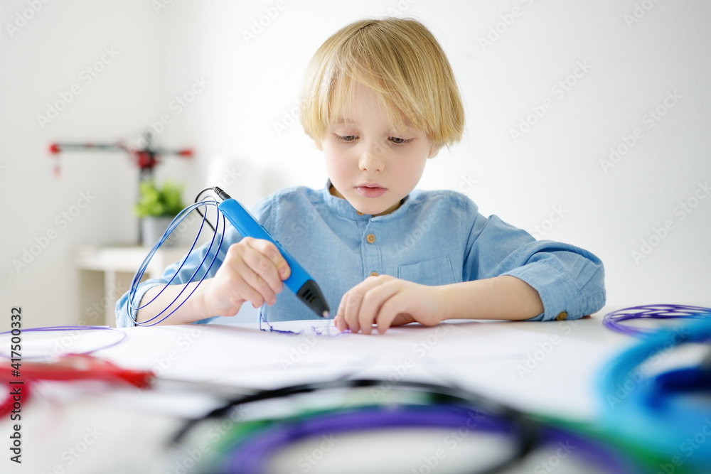 Little boy learning make model with 3d printing pen. Child playing with ...