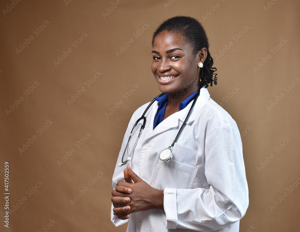 An African Nigerian female medical practitioner wearing a white outfit ...