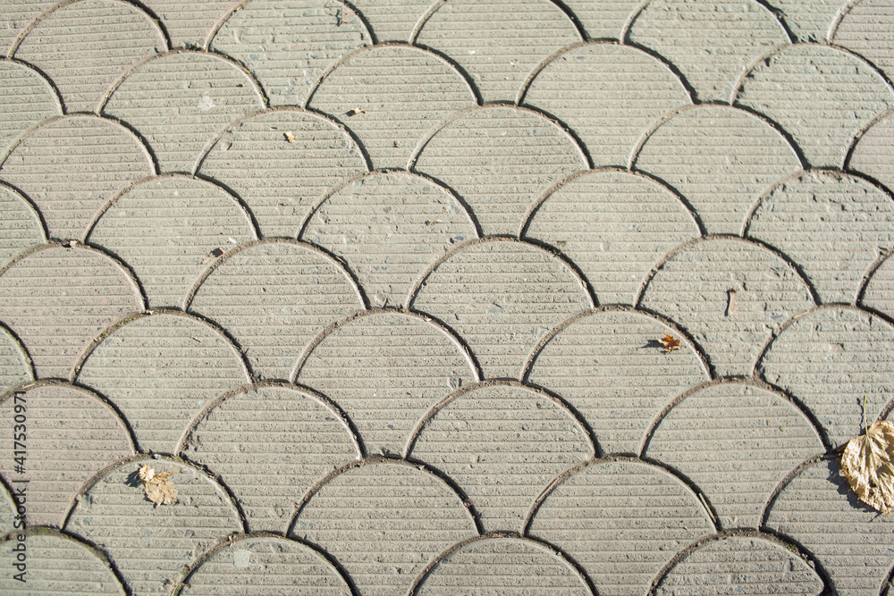Texture of stone paving stones. Cobblestone arched pavement road at the ...