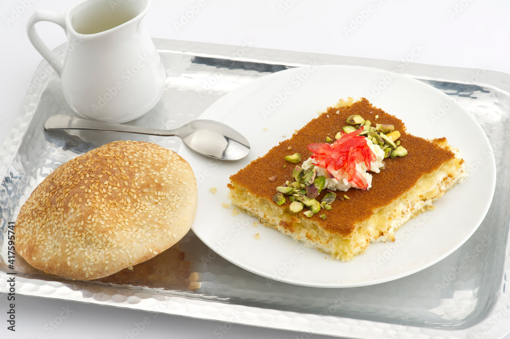 Turkish dessert kunefe, kunafa, kadayif with pistachio powder and ...
