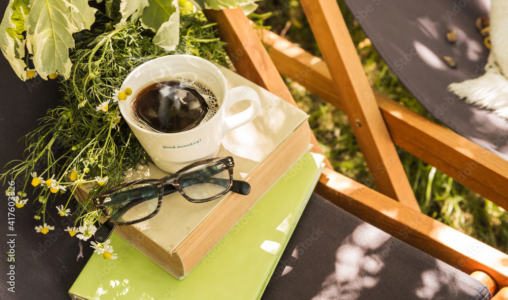 Coffee and books - summer outdoor leisure in the sunny garden Stock ...