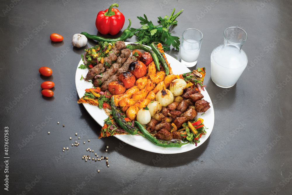 Lebanese Mixed Grill plate with arak on a dark background Stock Photo ...