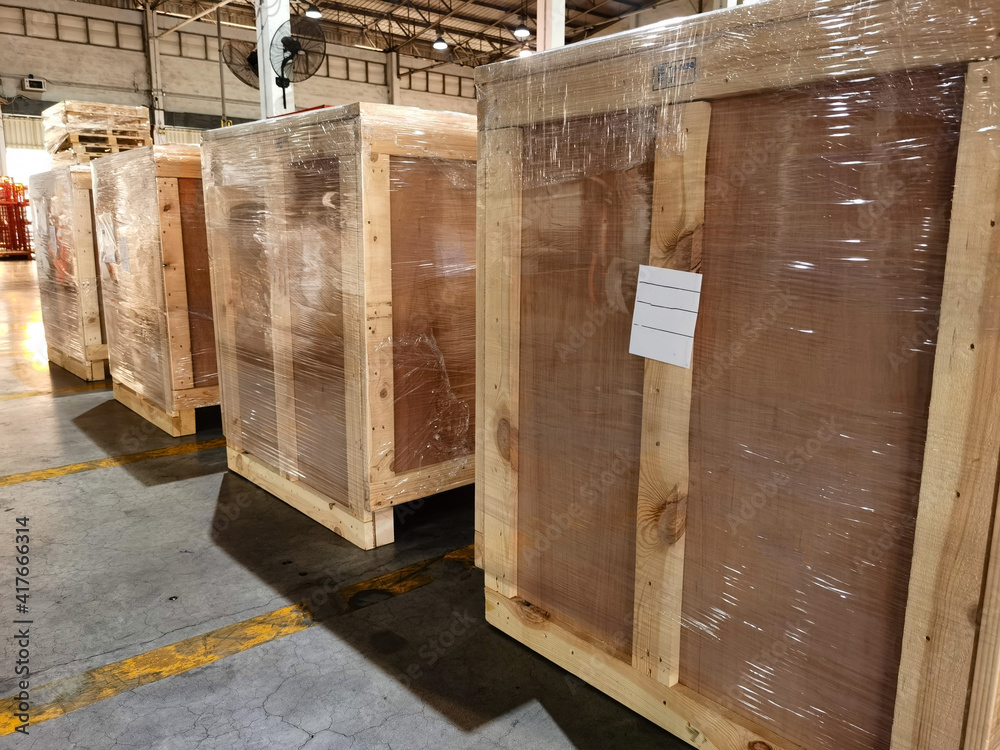 Shipment cartons box on pallets and wooden case on hand lift in ...