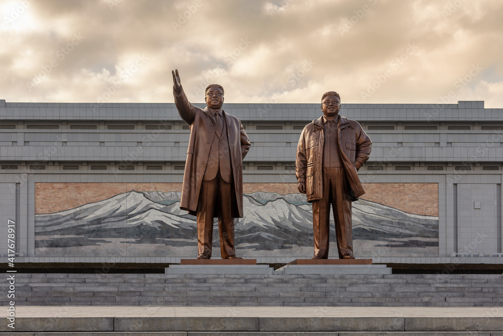Bronze statues of North Korean leaders Kim Il-sung and Kim Jong-il at the Grand Monument on ...