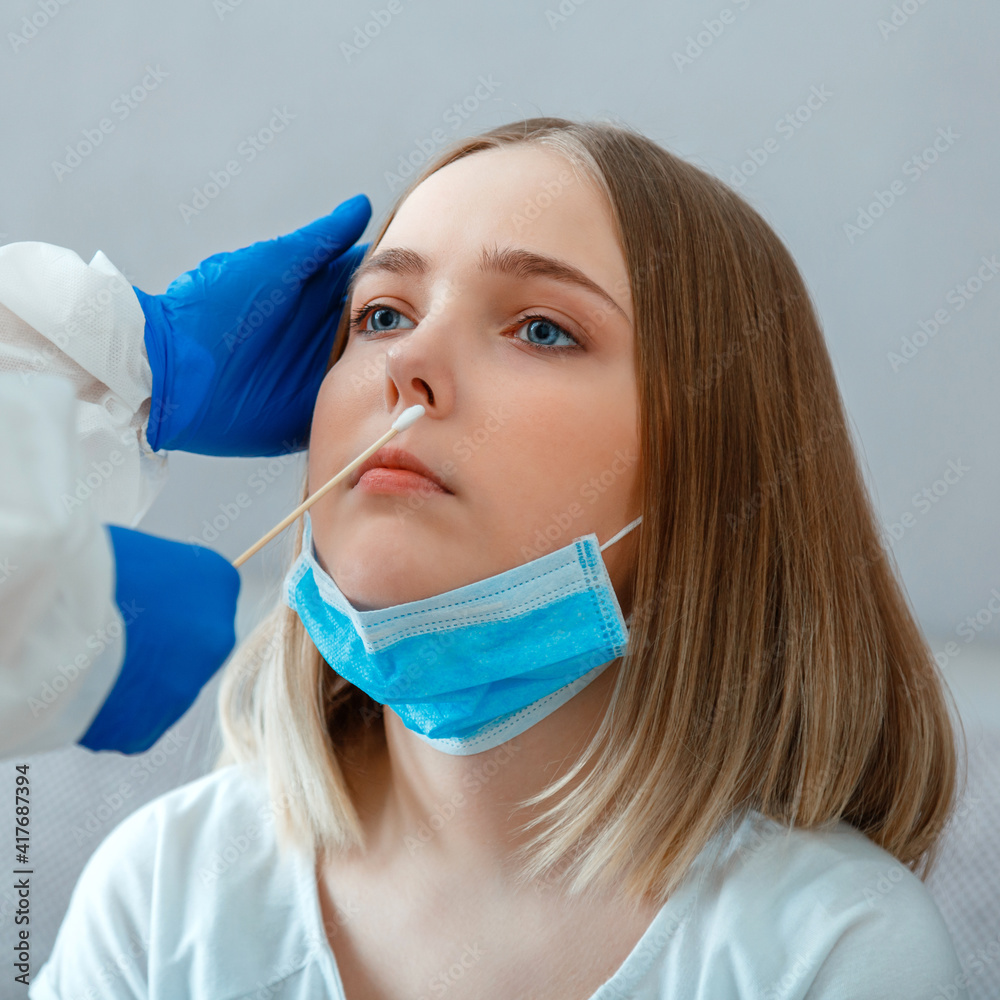 Doctor taking PCR test nasopharyngeal culture to woman patient. Nurse ...