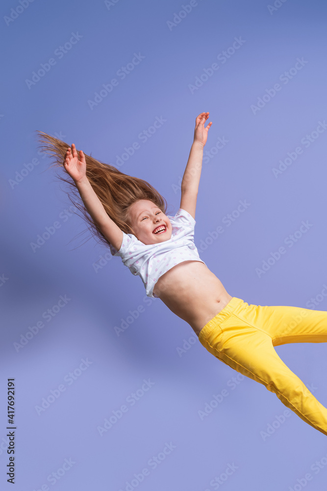 crazy excited little fun girl hanging happy upside down hands up on ...