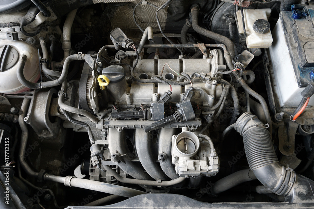 Top view of a partially disassembled engine of a modern car during ...