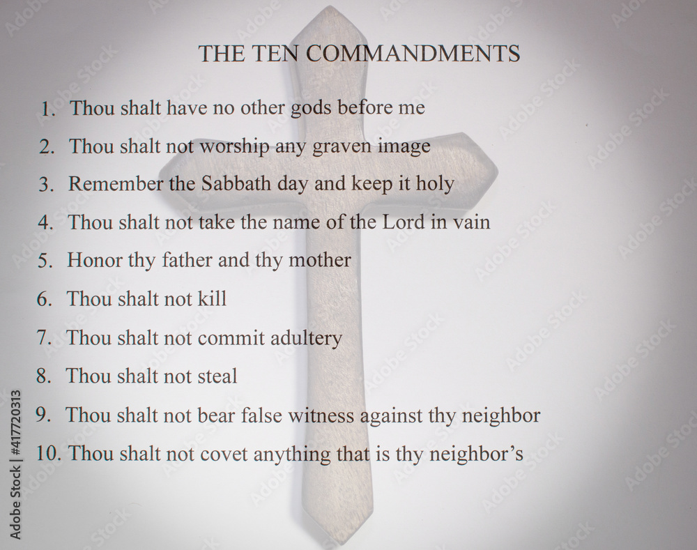 the ten commandments with a rustic wooden cross overlaid Stock Photo ...