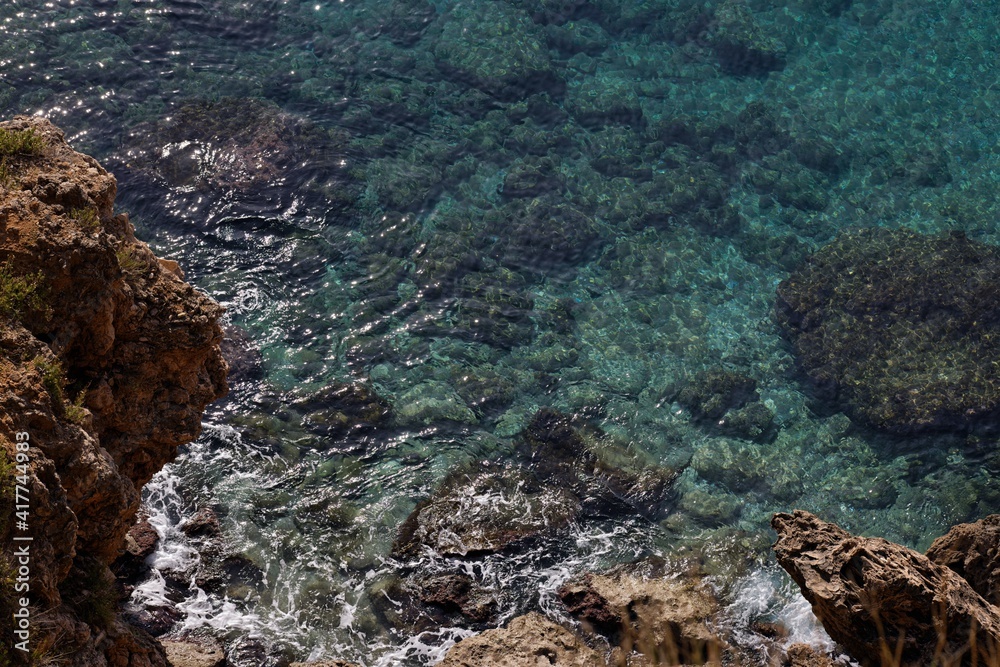 angry waves and waterfalls in the blue sea water ocean coast rocks ...