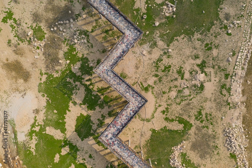 Aerial top view abstract view of the park ground on the folding ...