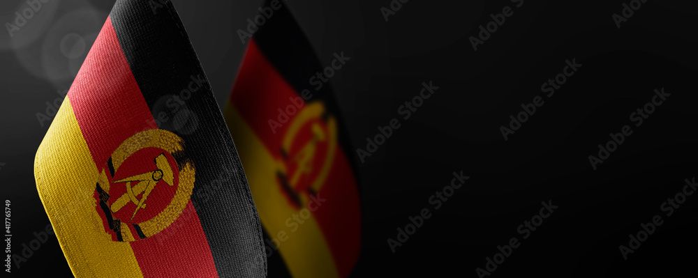 Small national flags of the GDR on a dark background Stock Photo ...