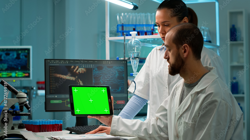 Man research scientist has conversation with famale bioengineer next to ...