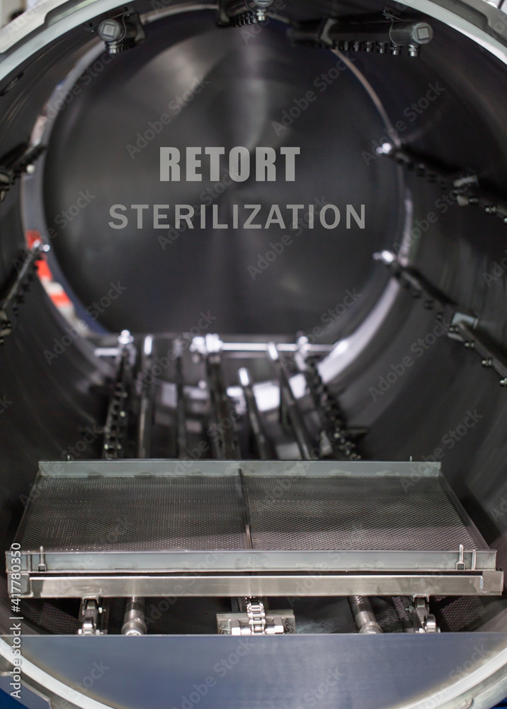 Close-up of automated batch retort sterilizer in food industry ...