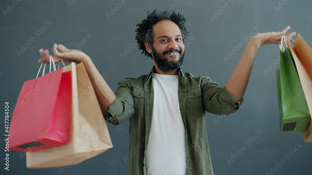 Vidéo Stock Portrait of middle-aged Arab man holding colorful paper ...