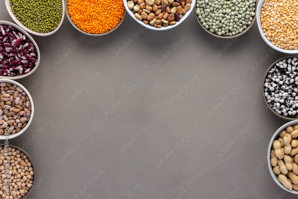 Different types of legumes in bowls, green and yellow peas, chickpeas ...