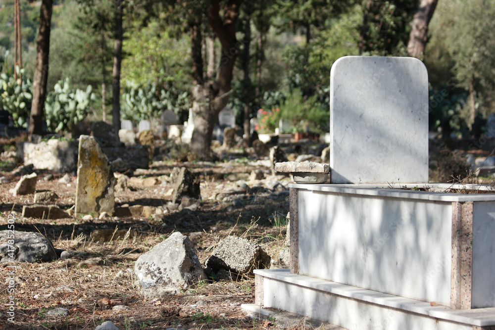 Gravestone in the muslim cemetery at Antalya, Turkey. Background of old ...