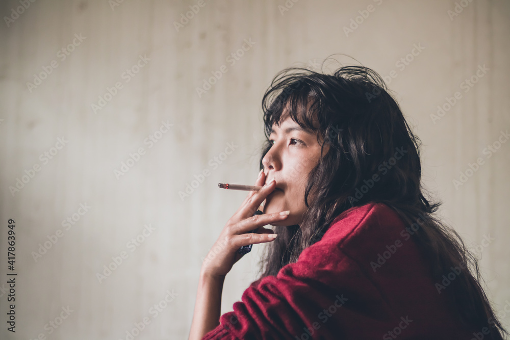 Stressed woman. A depressed woman smoking of stress Caused by social ...