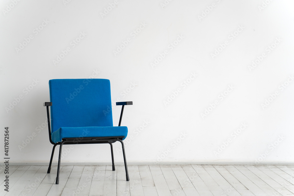 Blue chair on a white wall background in an empty room Stock Photo ...