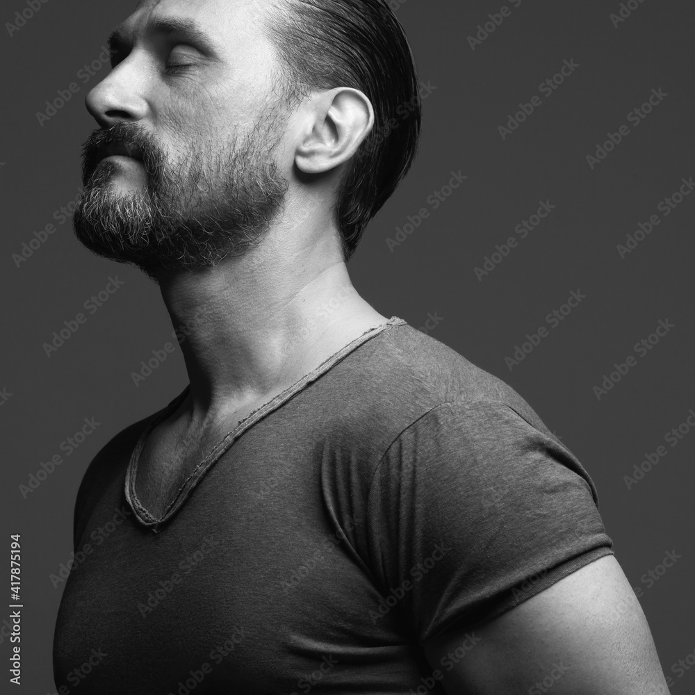 Fabulous at any age. Profile portrait of charismatic muscular 45-year ...