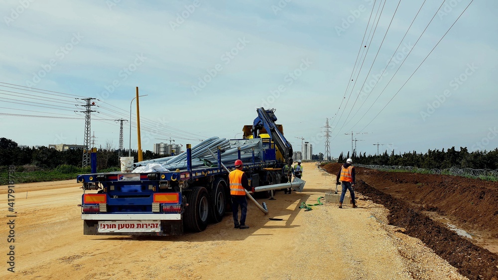 construction site installation of lighting devices, electrical work ...