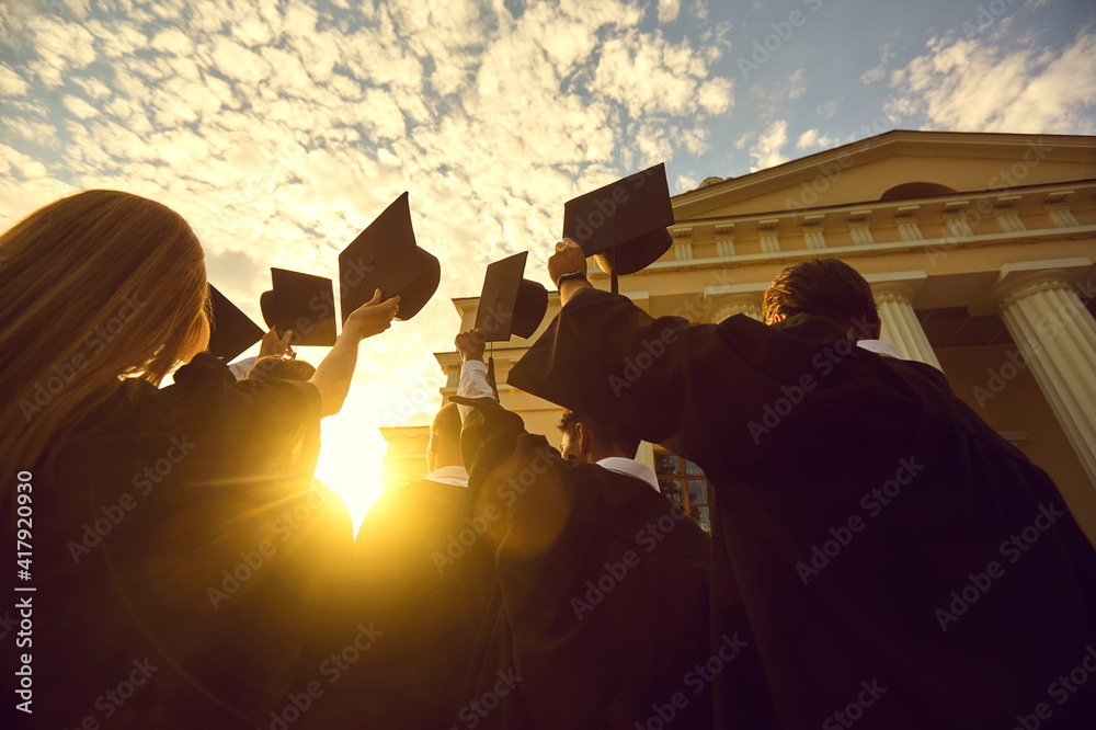 Group of young people university graduates in traditional masters ...