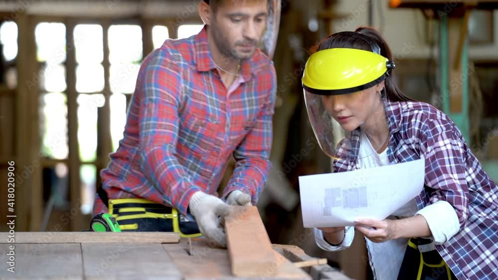 carpenter workers man and woman discussing to design the handcrafted ...