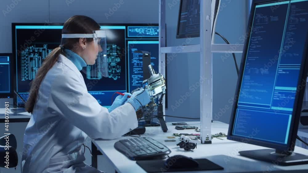 Female microelectronics engineer works in a modern scientific ...