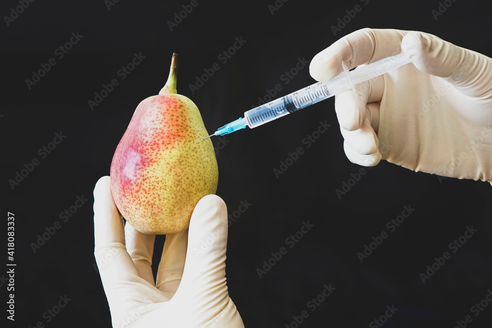 Genetically modified fruits concept. pesticides used in fruits food ...