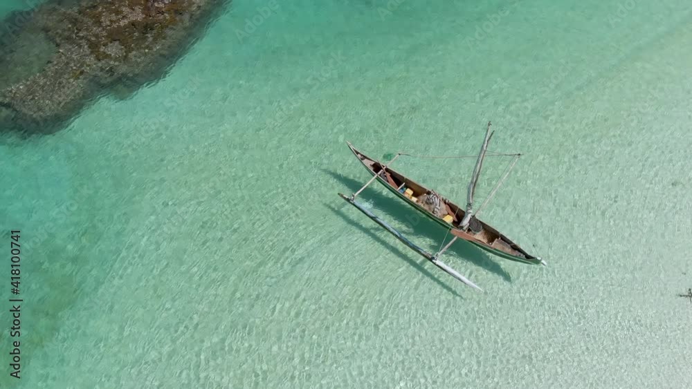 Various shots of isolated traditional outrigger canoes for tourists and ...