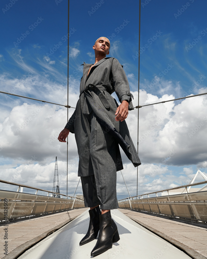 low angle view of male fashion model posing in city ภาพถ่ายสต็อก ...