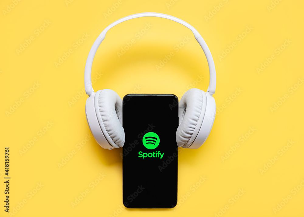 Spotify application icon on black screen of smartphone with white ...