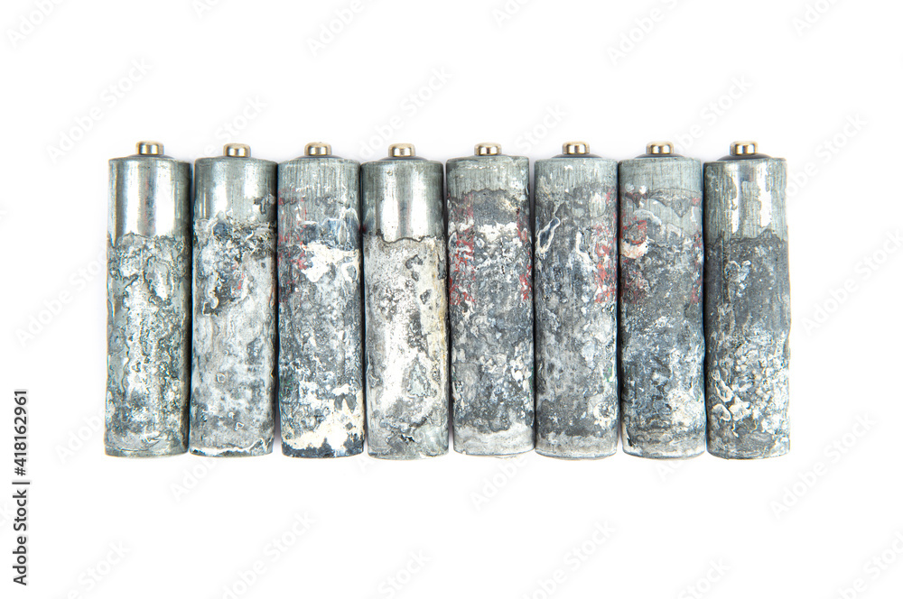 Heavily corroded AA batteries isolated on white Stock Photo | Adobe Stock