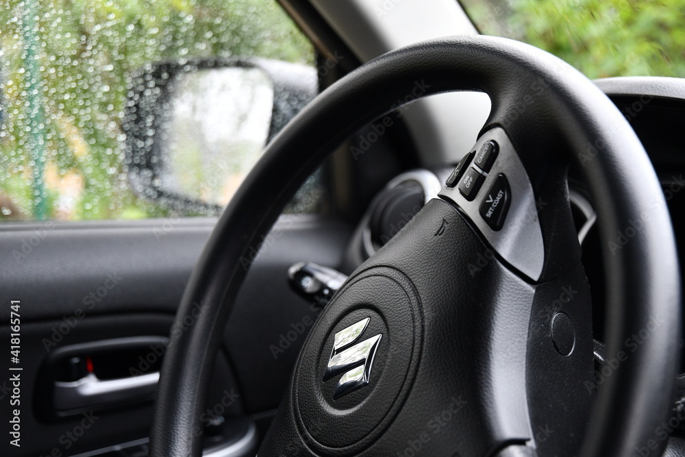 Suzuki car driver steering wheel with control panel buttons. Black ...