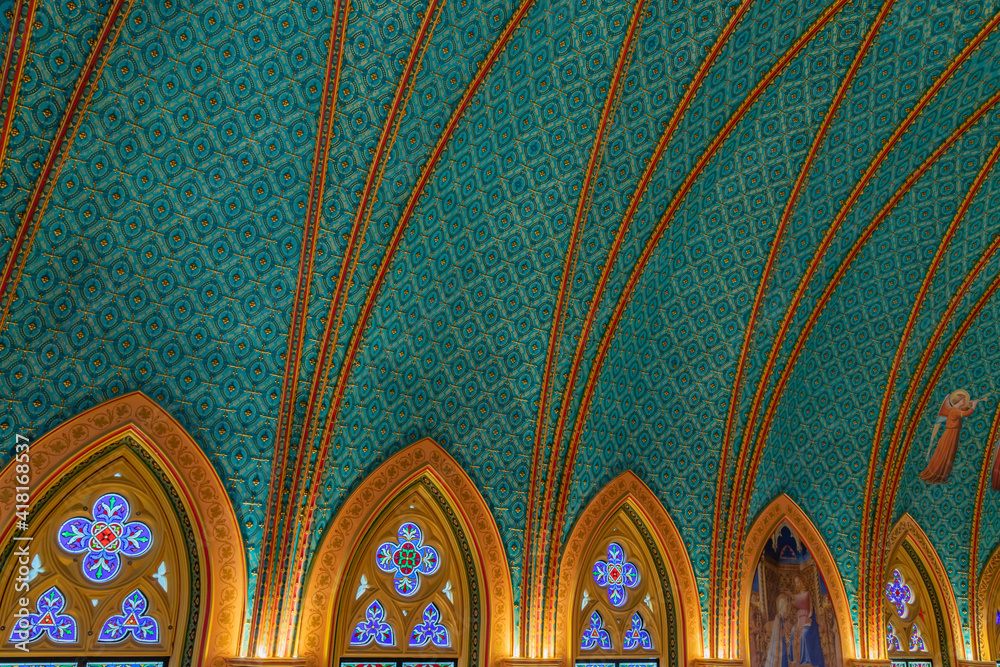 Polychrome gothic plaster lining in a Catholic church, with a light ...