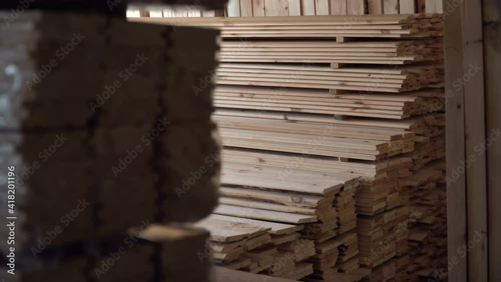 Wooden planed products. Warehouse for wood building materials. Boards ...