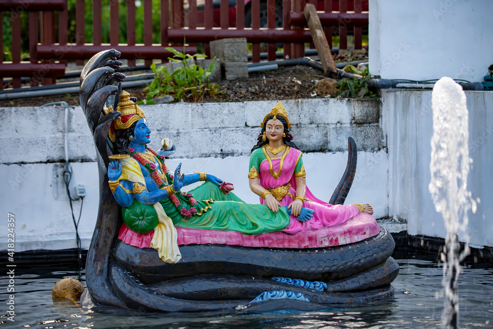 Statue of Vishnu, Hindu god, sacred crater lake Grand Bassin or Ganga ...